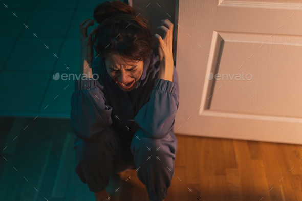 Upset woman screaming and crying in the dark Stock Photo by ...