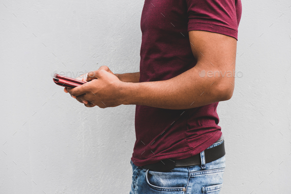 Profile part of male body with hands holding mobile phone Stock Photo ...