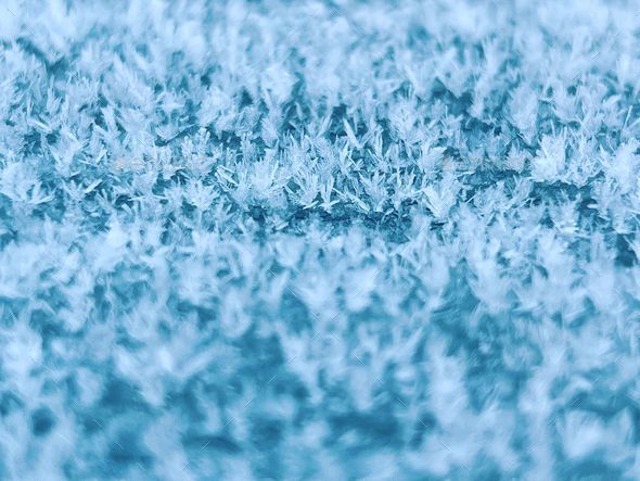 Close-up shot of a cold, frosty surface exhibiting a crystalline ...