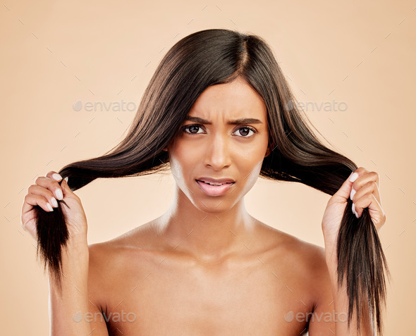 Hair, damage and portrait of woman in stress on studio background for ...