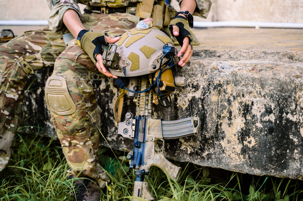 Smart teamwork of soldiers running forward and attacking enemy during ...