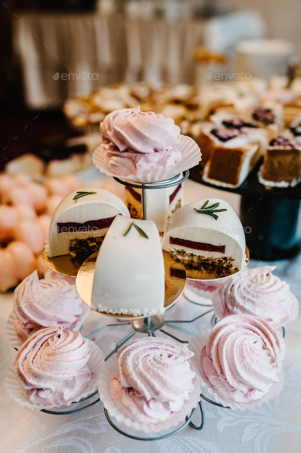 Sweet table. A plates of cakes. Table with sweets, buffet. Dessert ...