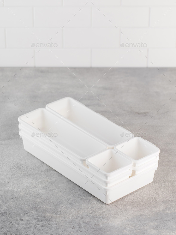 A set of plastic containers, boxes for convenient storage inside a ...