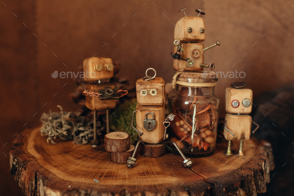 Cute family of robots made by hand from scrap materials, wooden robot ...