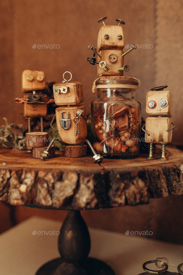 Cute family of robots made by hand from scrap materials, wooden robot ...