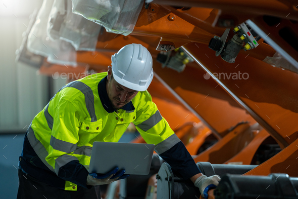 Engineer check and control welding robotics automatic arms machine at ...