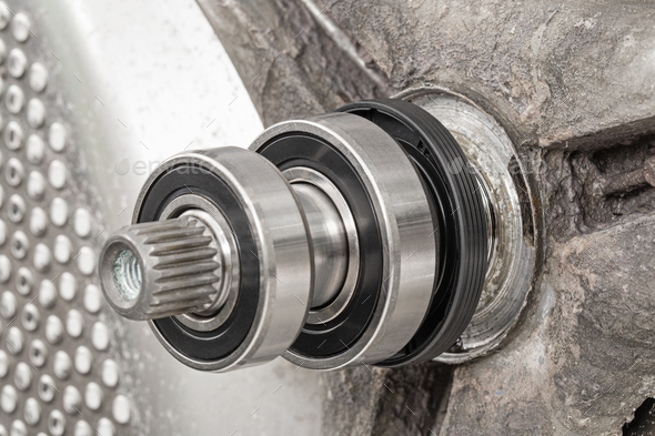 Replacing bearings and shaft cuffs on the washing machine drum - Stock ...