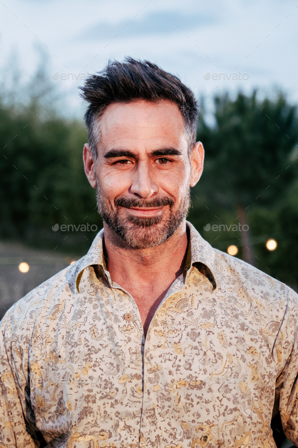 Vertical individual portrait of one middle aged handsome man standing ...