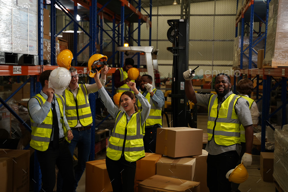 Successful warehouse team smiling happily,Cheerful logistics workers in ...