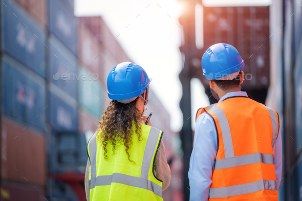 Engineer container cargo with worker working and checking stock into ...