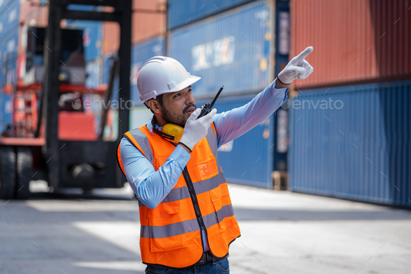 Technician working checking stock into container for loading at ...