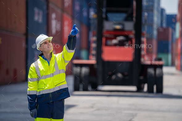 Professional container yard workers checking stock for loading in the ...