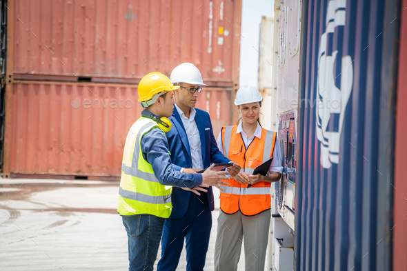 Engineer and businessman checking a quality of containers box from ...