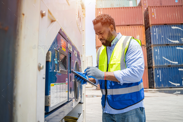 Worker check list of container cargo at container depot terminal. Stock ...