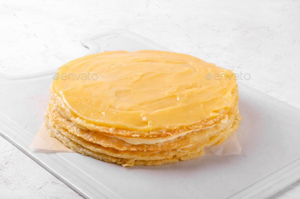 Preparing chopped cake with lemon curd and buttercream. Putting the ...