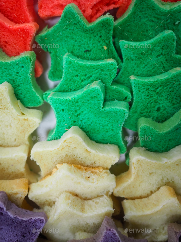 pastry chef slicing red violet yellow and green star and heart shaped ...