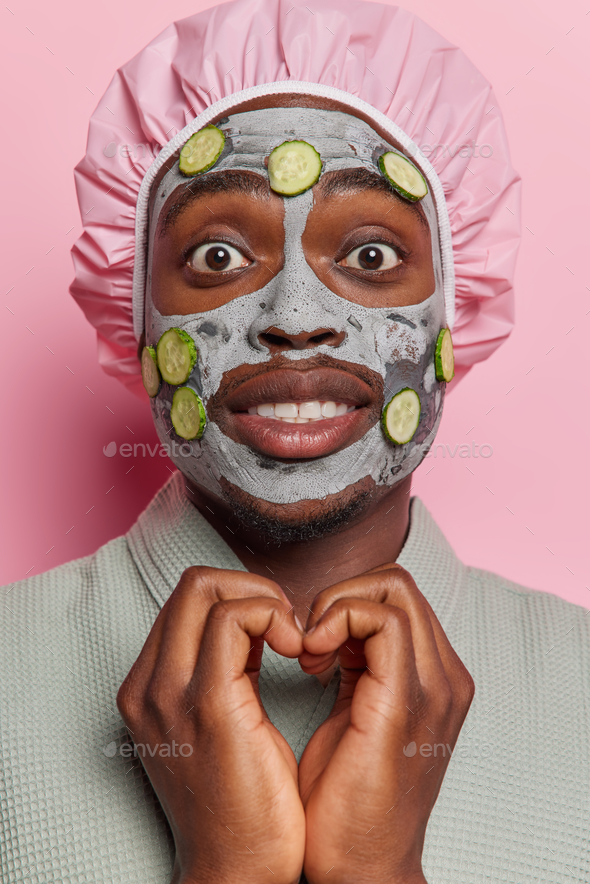 Vertical shot of surprised dark skinned man reflecting his desire for ...