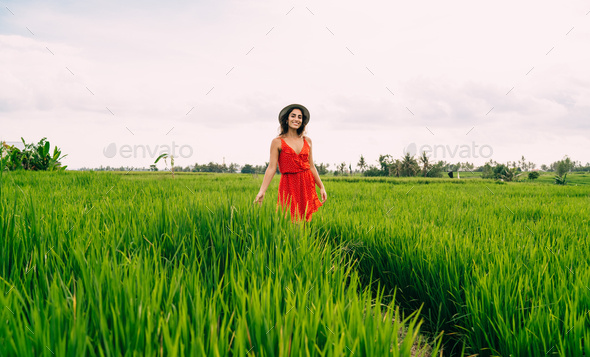 Optimistic woman walking through path Stock Photo by GaudiLab | PhotoDune