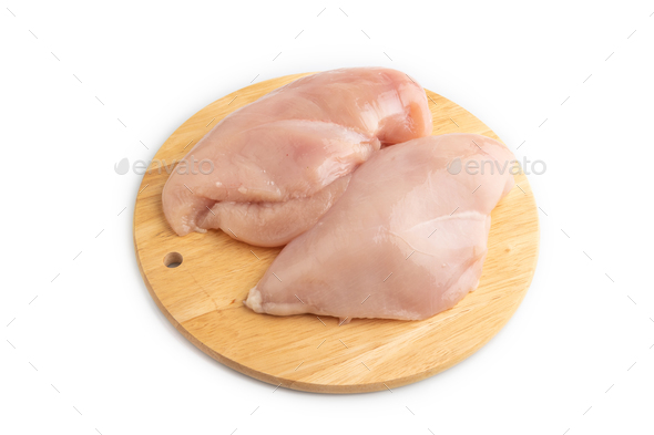 Raw chicken breast isolated on white background. Side view, close up ...