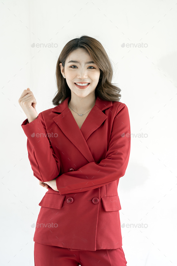 Image of happy young business woman in red suit posing isolated over ...