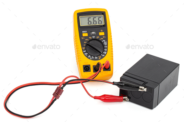 Testing an acid rechargeable battery with a measuring instrument ...