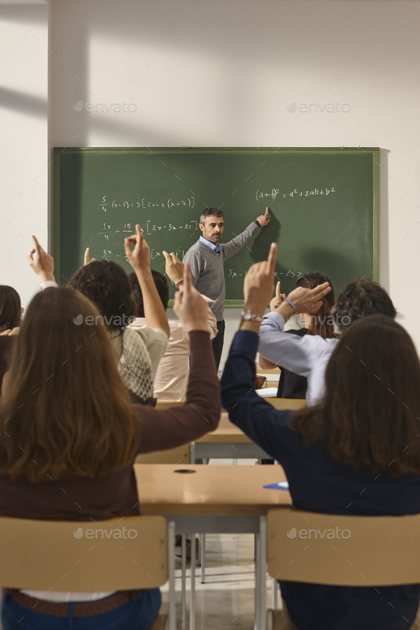Math teacher giving lessons. Classroom with students. Elementary ...