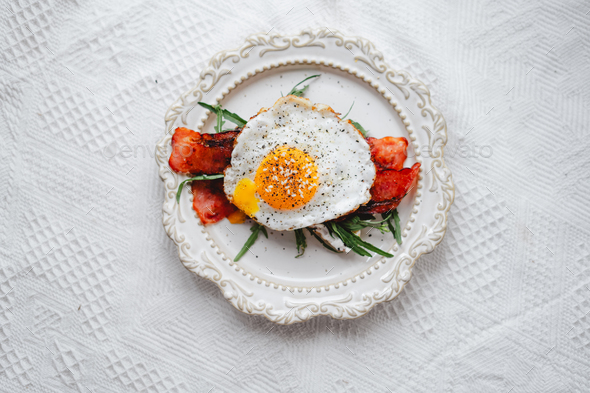 bacon fried egg toast on white background Stock Photo by ArtRachen