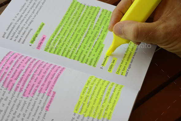 Wrong technique to use highlighting technique in a book. Stock Photo by alessandrozocc