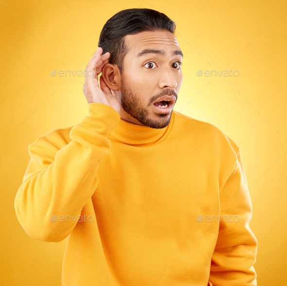 Asian man, listening and gossip with hand on ear in studio background ...