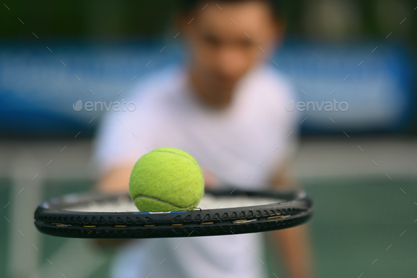 Close up view of male tennis player holding racket and ball. Stock ...