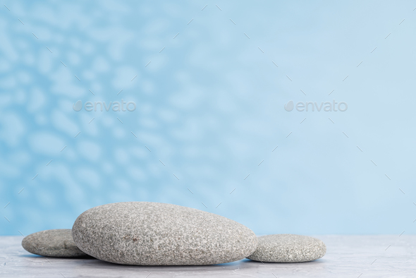 Backdrop with smooth sea pebbles, perfect podium Stock Photo by karandaev