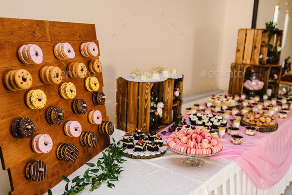 Candy bar. Table with different sweets for party. Wooden wedding decor ...