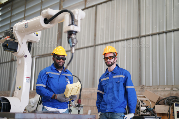 Robotics engineer fitting sensors to traditional engineering lathe in ...