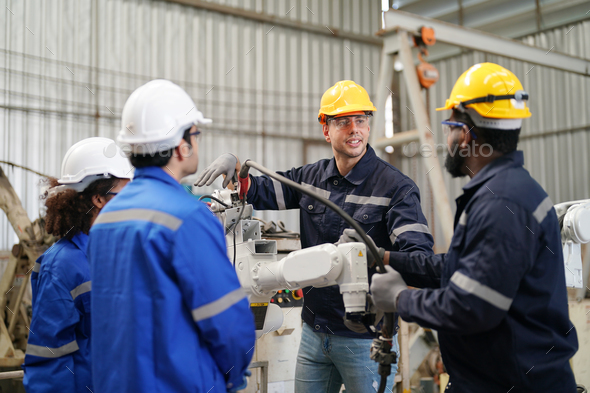 Robotics engineer fitting sensors to traditional engineering lathe in ...