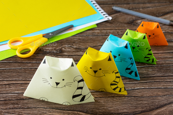 Origami toy made from paper puppets cat. Stock Photo by khramovaelena