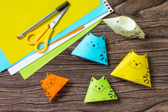 Origami toy made from paper puppets cat. Stock Photo by khramovaelena