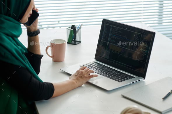 Muslim Software Developer Working on Laptop Stock Photo by DragonImages