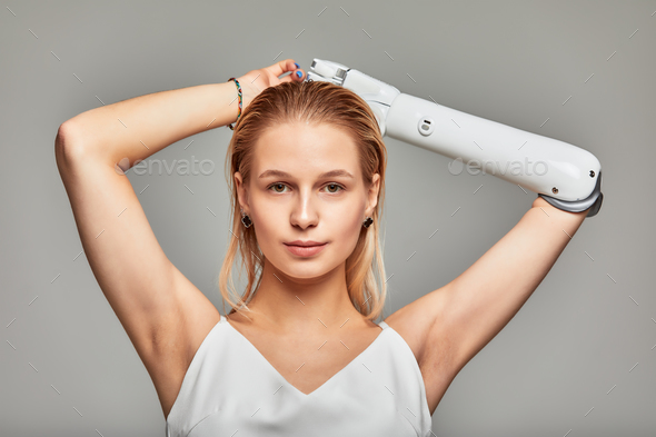 Close-up studio portrait of beautiful young blonde girl with disability ...