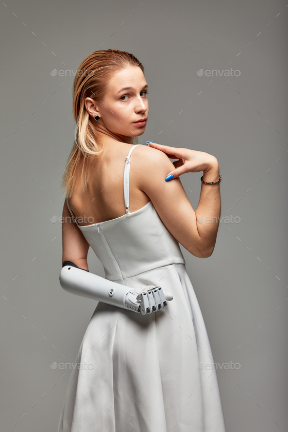 Studio portrait of young girl with disability wearing sensory bionic ...