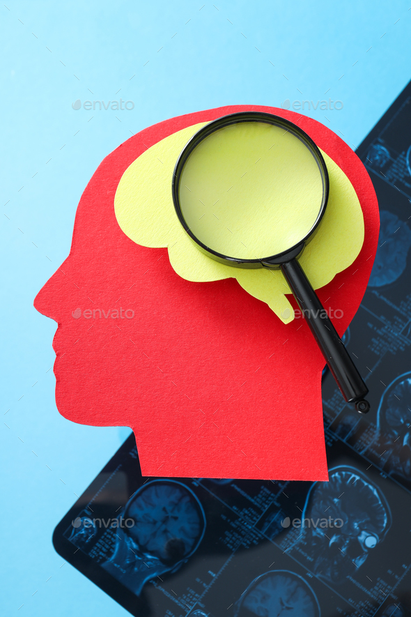 MRI images or magnetic resonance imaging with paper human head and ...