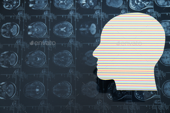 Images of MRI or magnetic resonance imaging with a paper human head ...