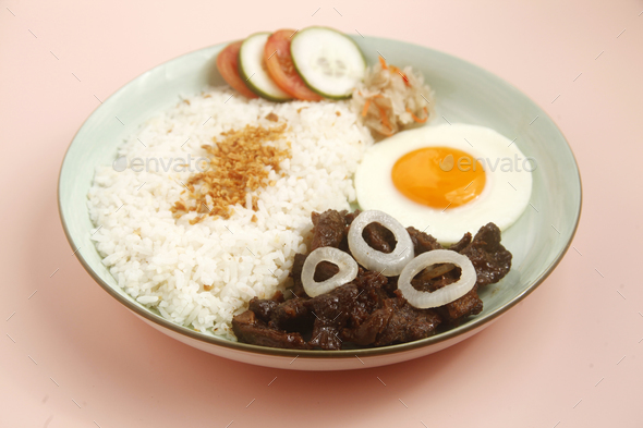 Freshly cooked Filipino food called TapSilog Stock Photo by junpinzon