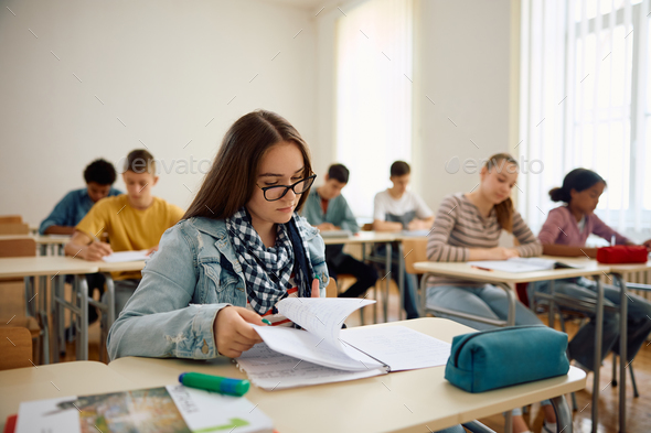 Female high school student learning on a class in the classroom. Stock ...