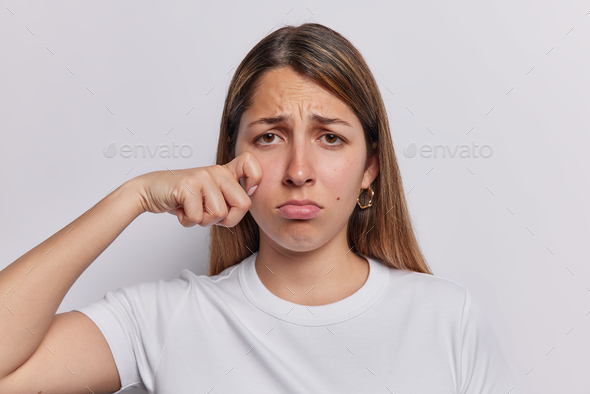 Upset doleful young woman breaks down in sobs and cries of despair ...