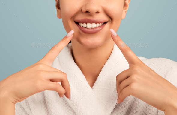 Anonymous female model showing perfect teeth Stock Photo by kegfire