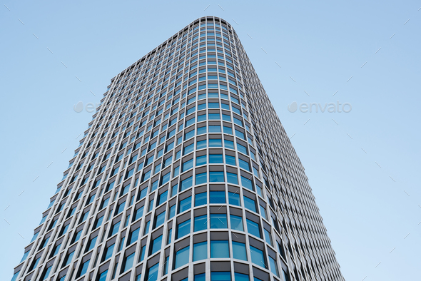 Modern high-rise residential building against the blue sky during the ...