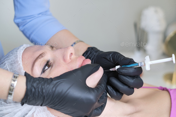 detailed view of a chin injection procedure, showcasing the careful ...