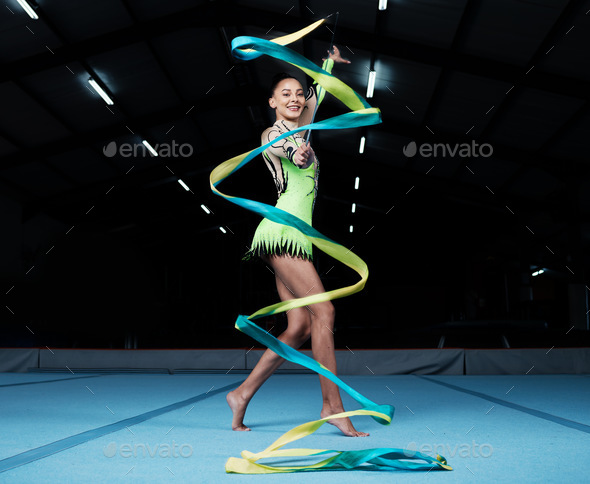 Girl, portrait and gymnast with ribbon for practice during competition ...