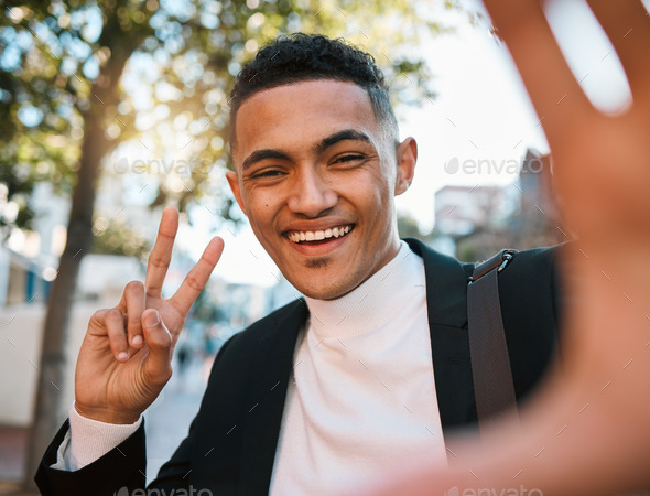 Selfie, peace sign and portrait of business happy man in city for ...