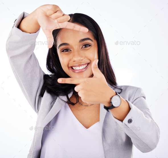 Finger framing, portrait and business woman in studio, white background ...